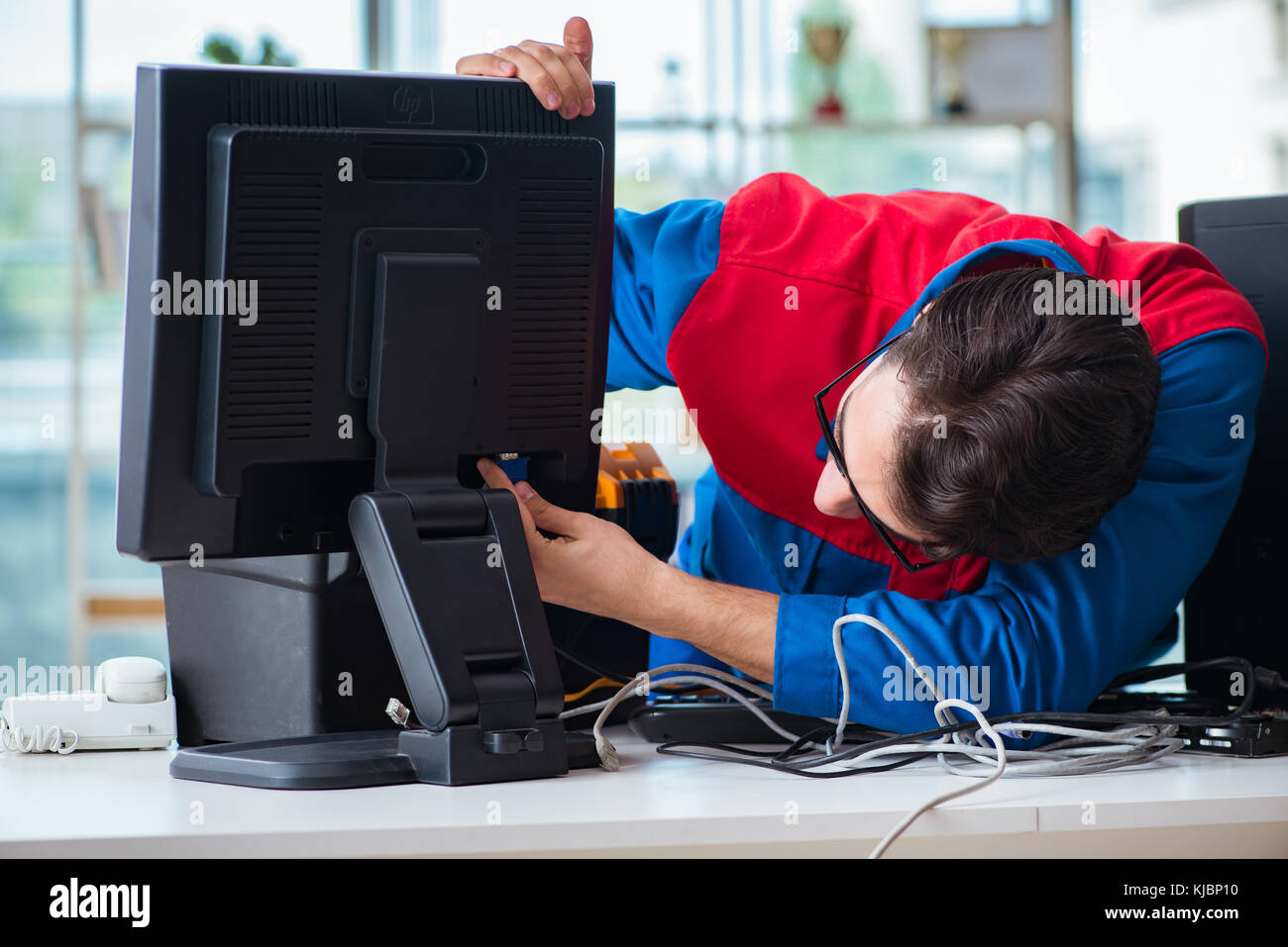 Computer repairman working on repairing computer in IT workshop Stock ...