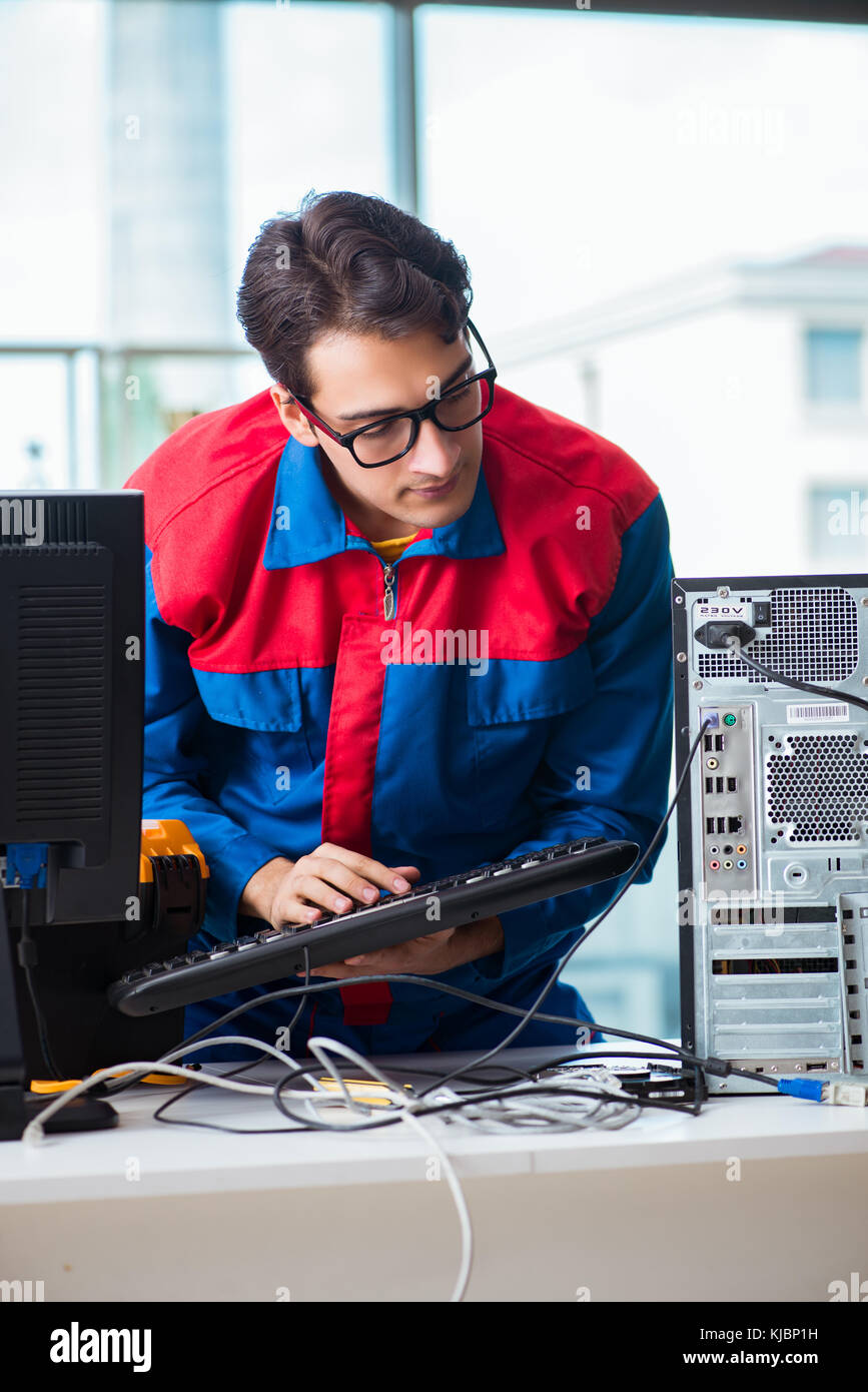 Computer repairman working on repairing computer in IT workshop Stock ...