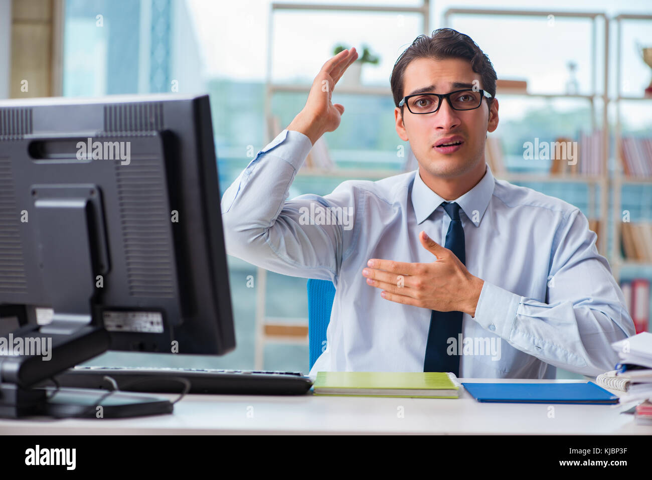 Businessman suffering from excessive armpit sweating Stock Photo - Alamy