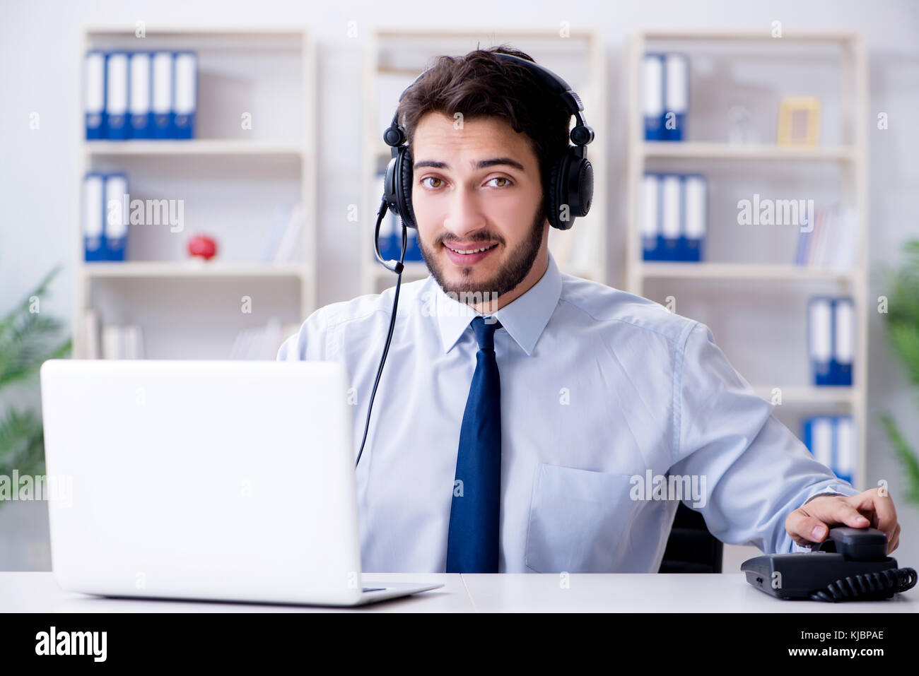 Call center employee working in office Stock Photo - Alamy