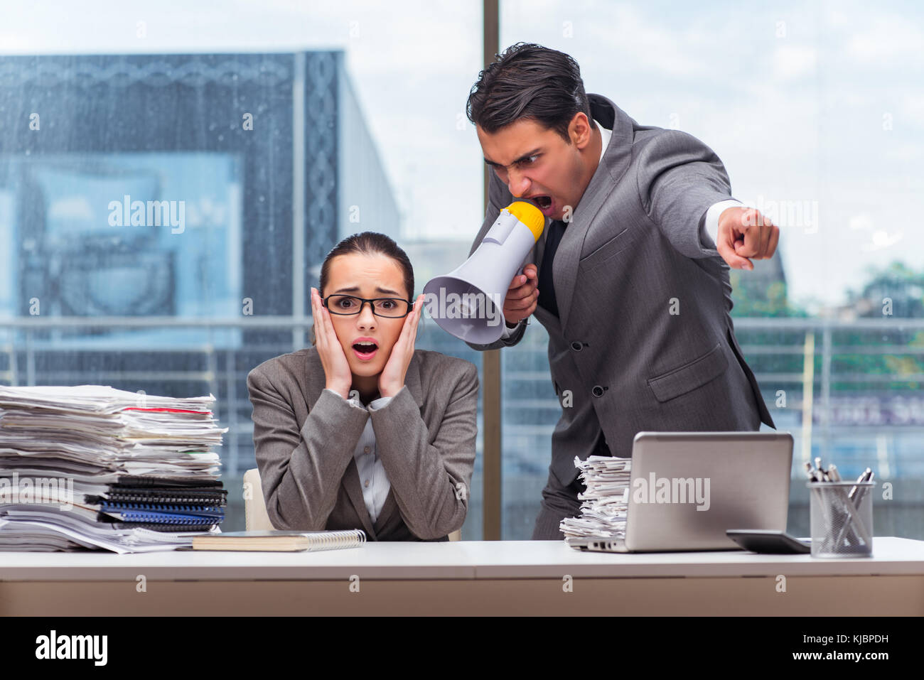 Boss yelling at his team member Stock Photo - Alamy