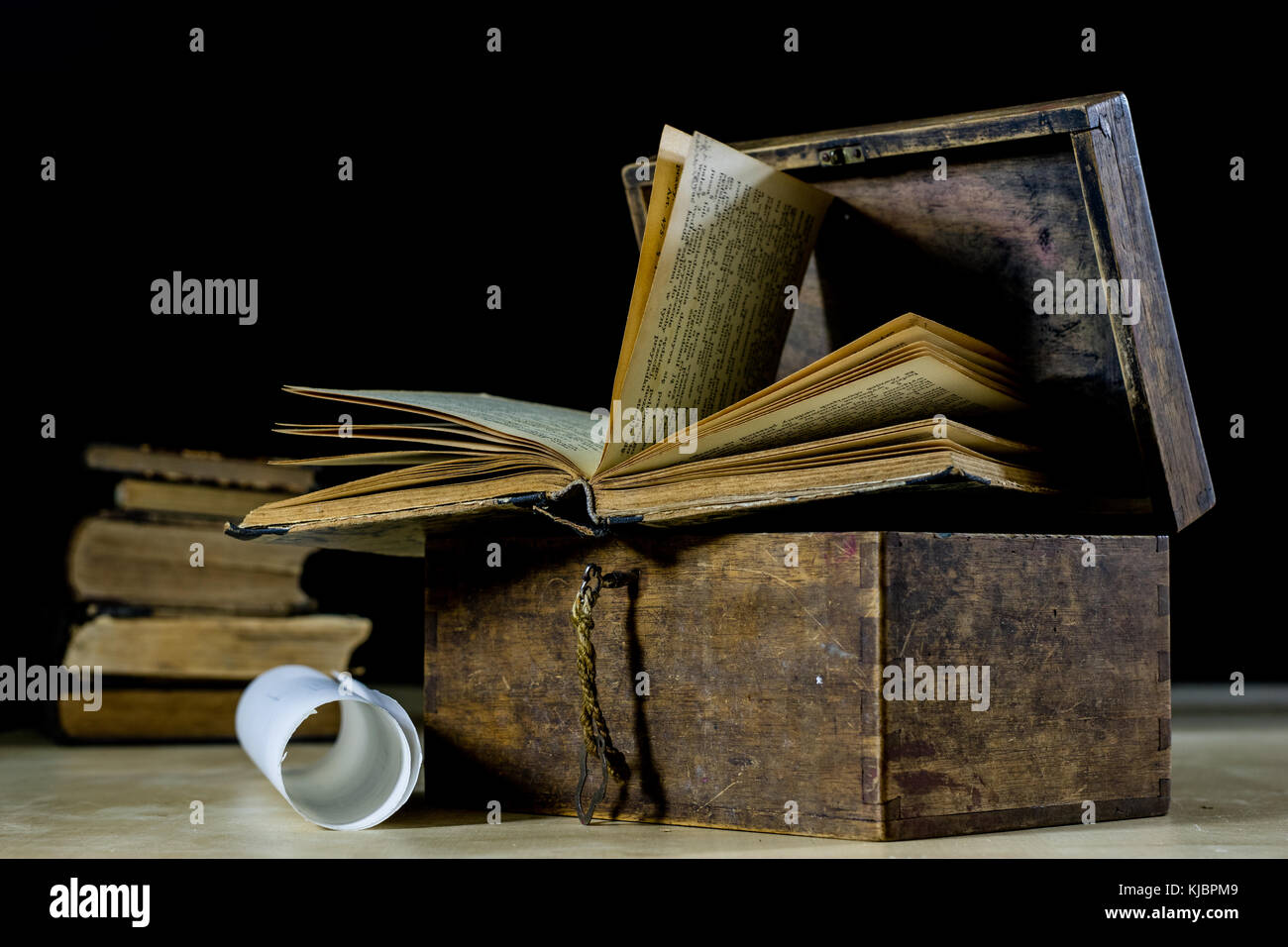 Old rolls and plans in folded paper rolls. Old book and case. Documents ...