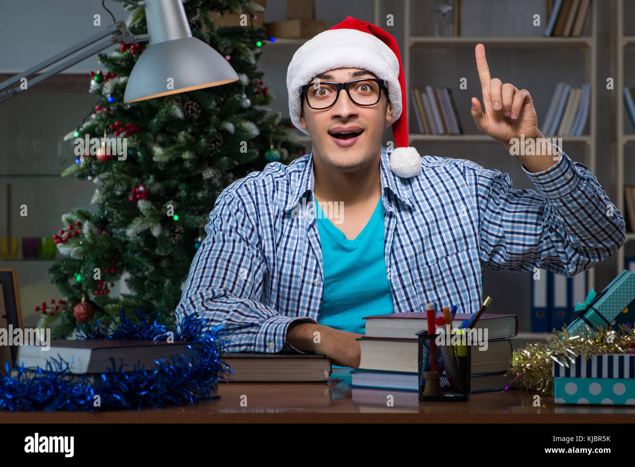 Young man working at home on christmas day Stock Photo - Alamy