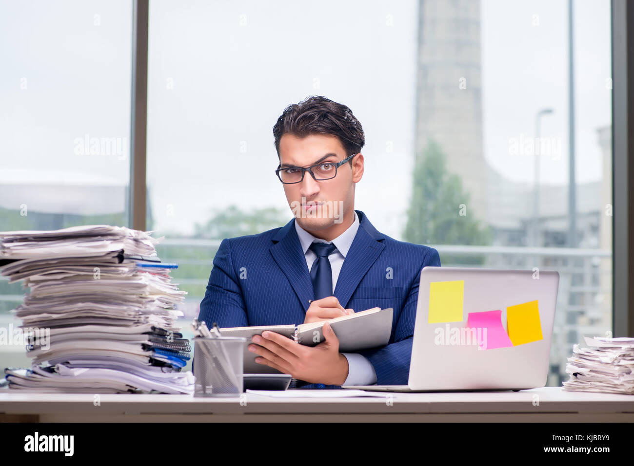 Workaholic businessman overworked with too much work in office Stock ...