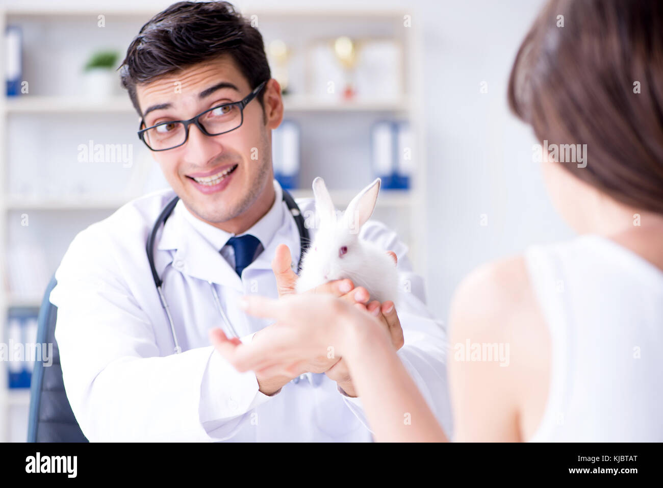 Woman with pet rabbit visiting vet doctor Stock Photo - Alamy