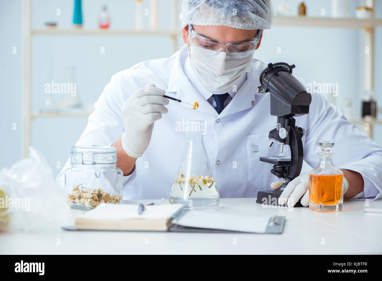 Chemist mixing perfumes in the lab Stock Photo - Alamy