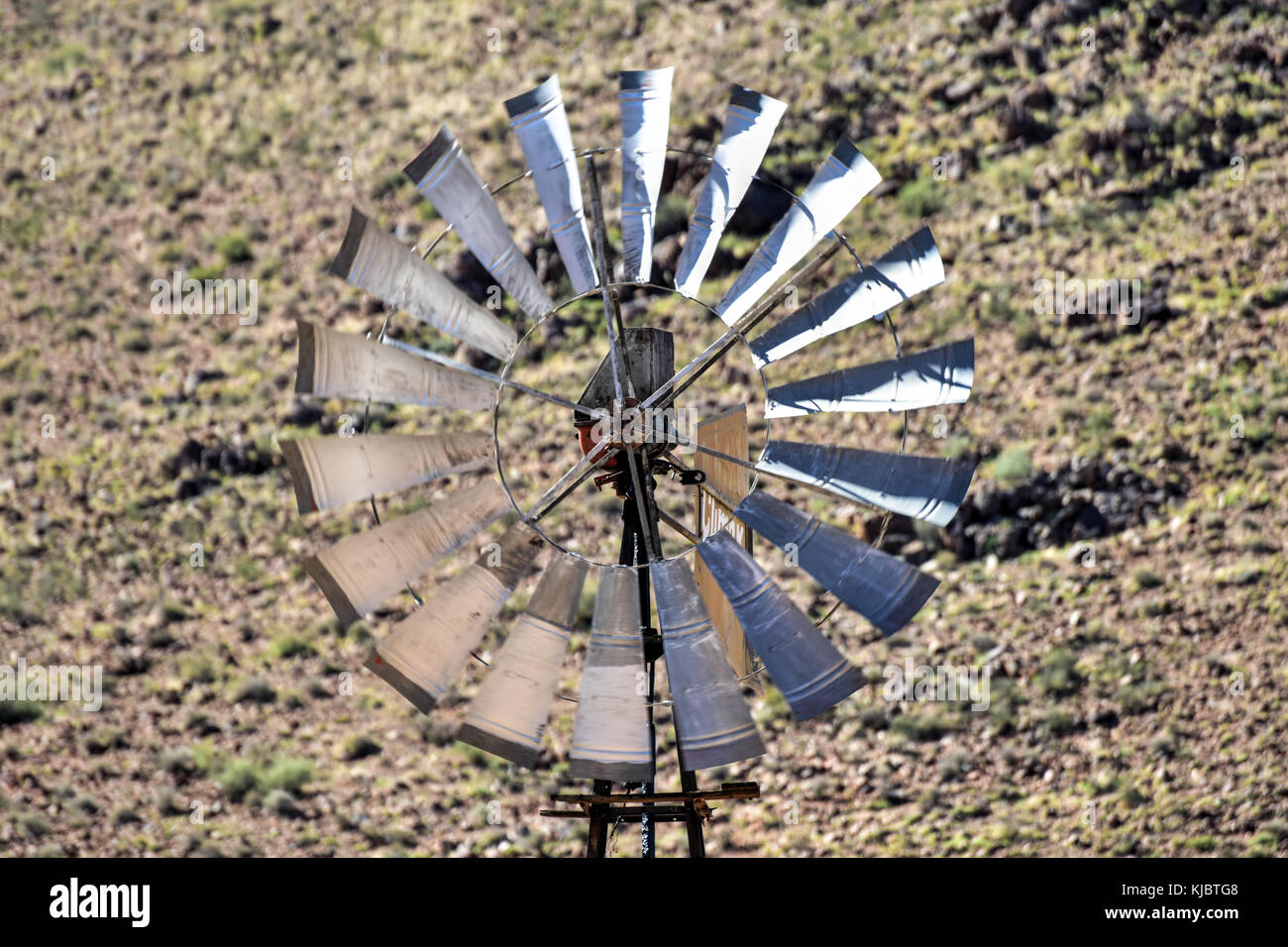 Windmill in the desert landscape of Namibia Stock Photo - Alamy