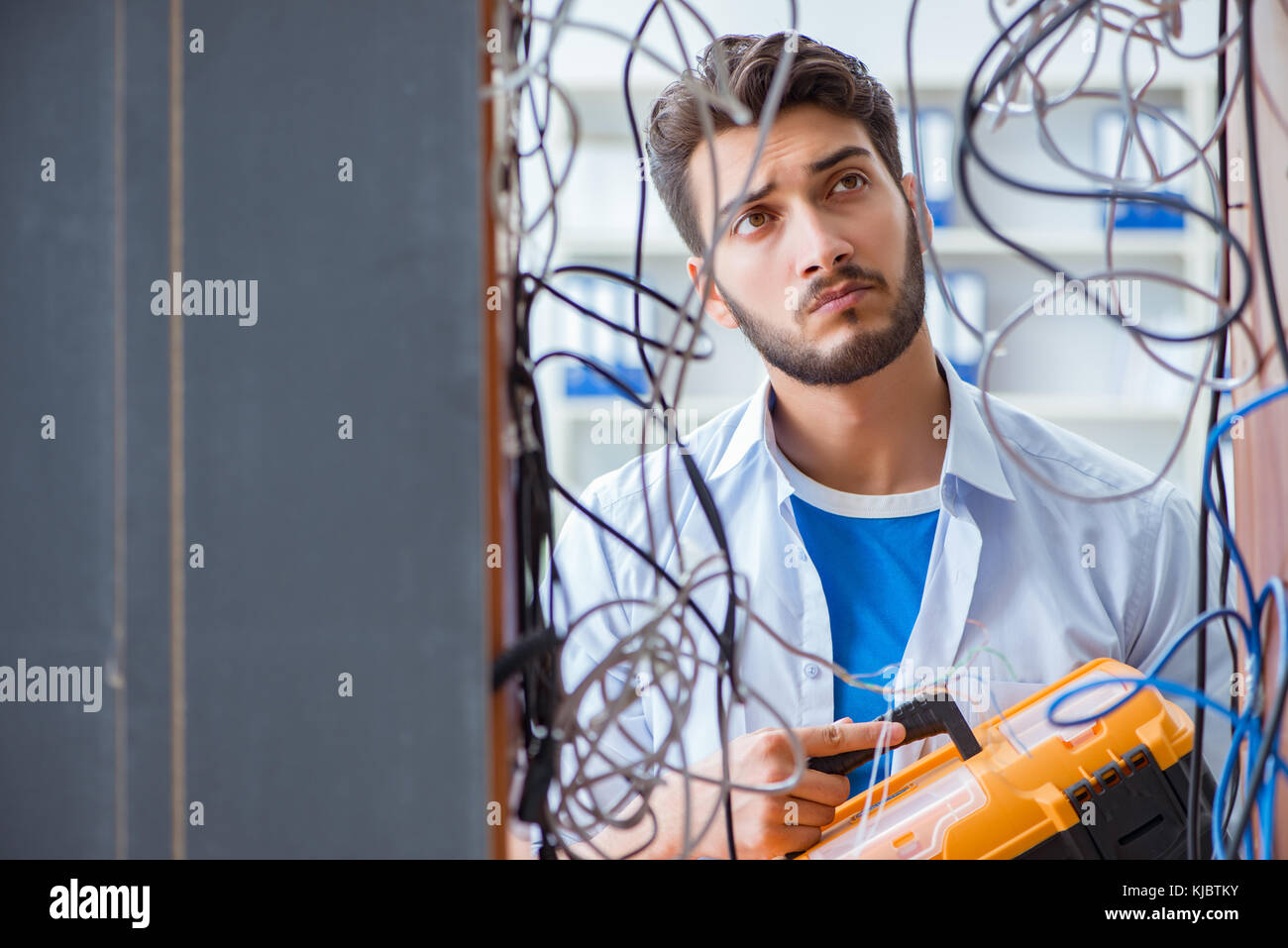 Computer repairman working on repairing network in IT workshop Stock ...