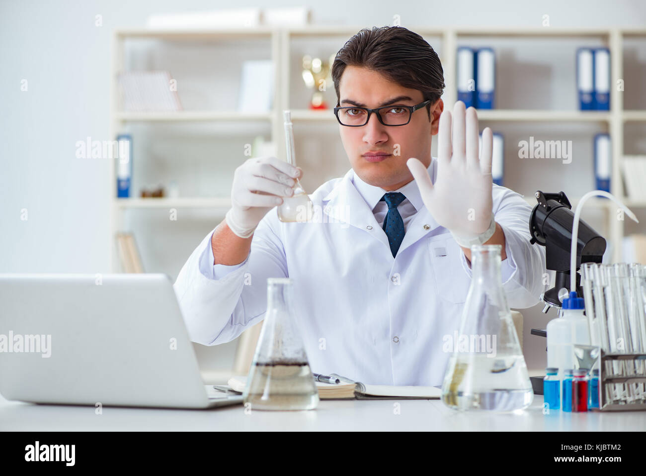 Young researcher scientist doing a water test contamination experiment ...