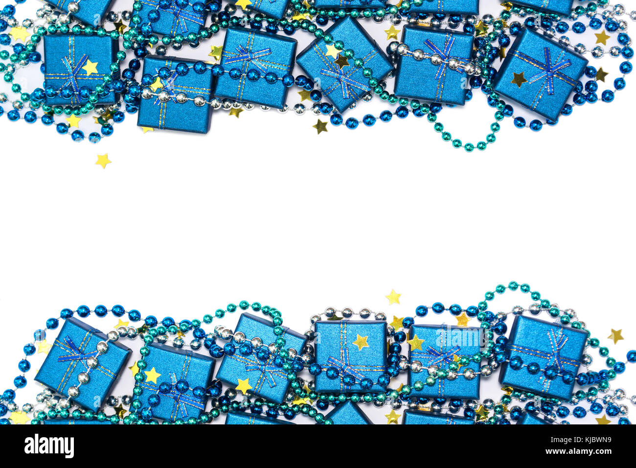 Festive frame of blue shiny gift boxes, blue beads and golden confetti ...