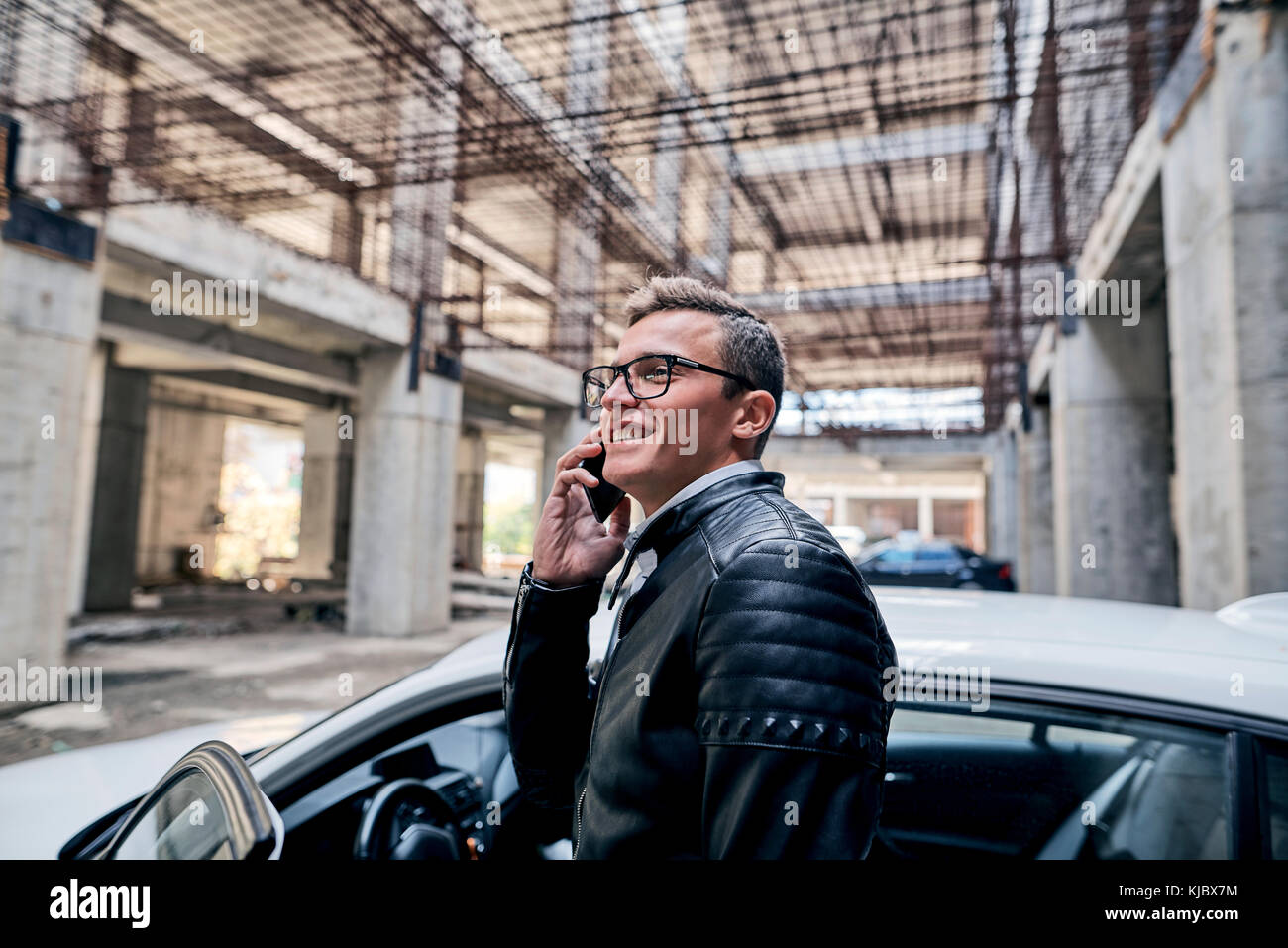 man gets out of the car Stock Photo - Alamy