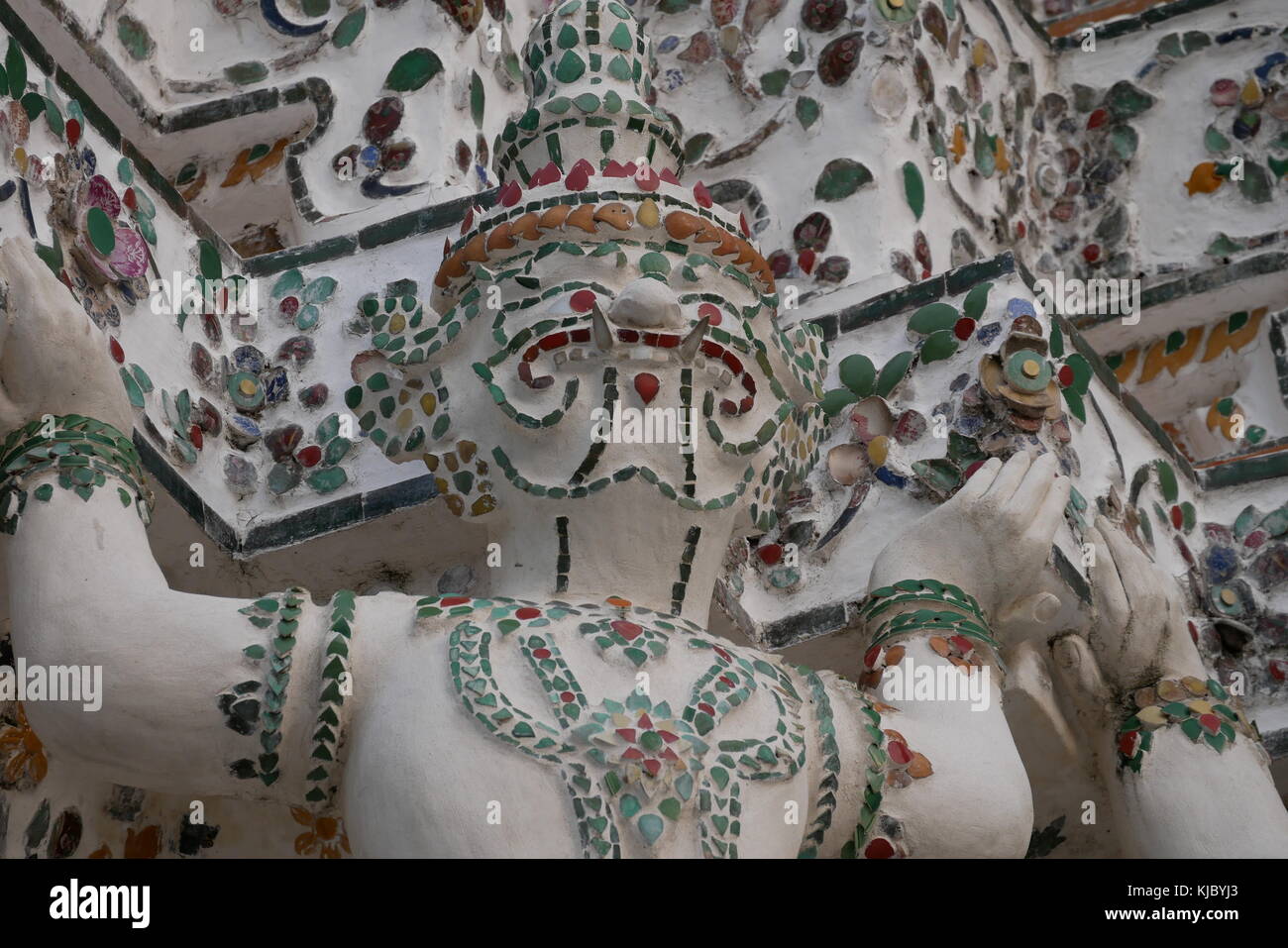 The statue of a Chinese soldier made of tiles on Wat Arun's facade, the ...