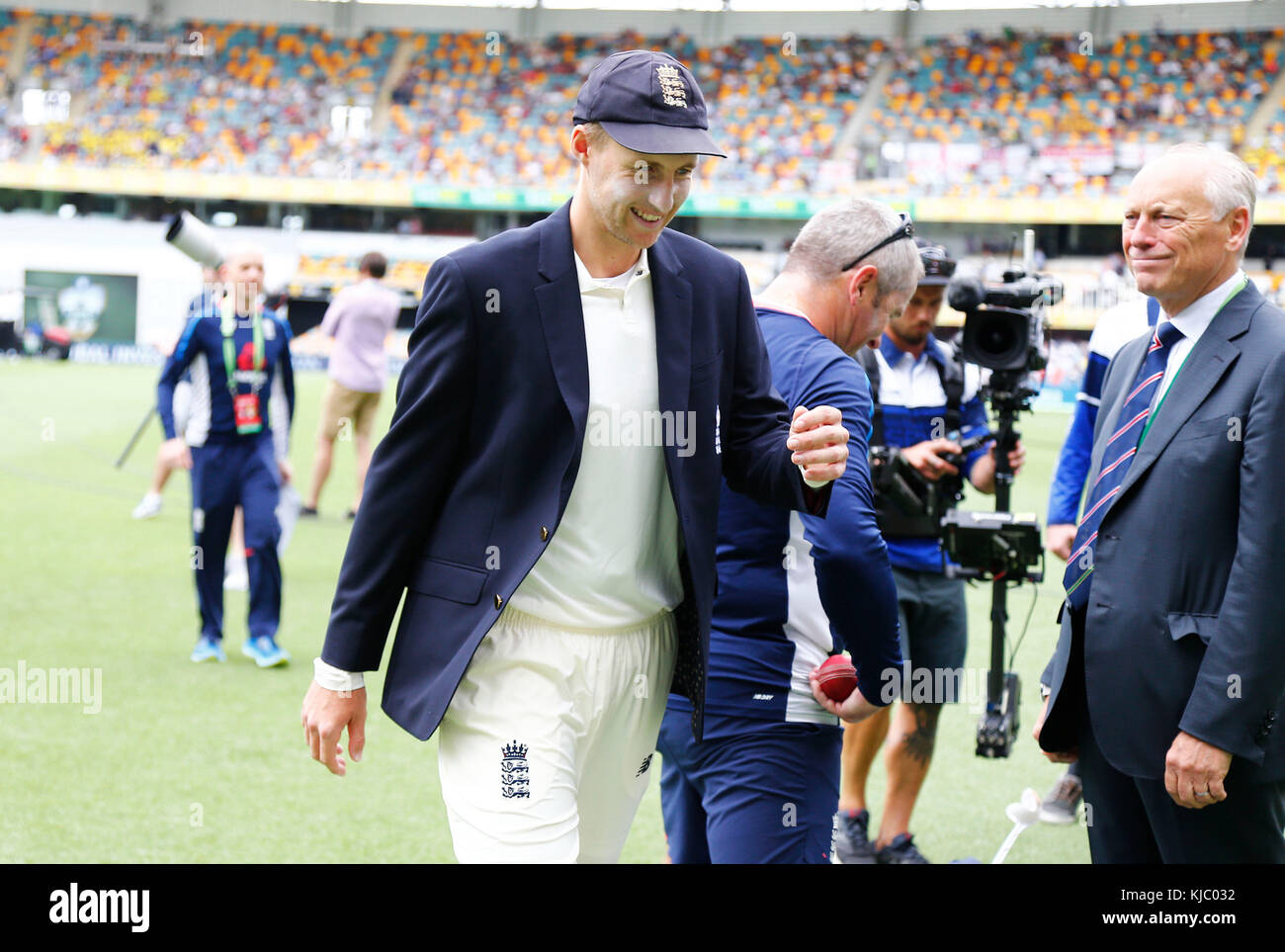 England's Joe Root smiles after winning the toss before the start of ...
