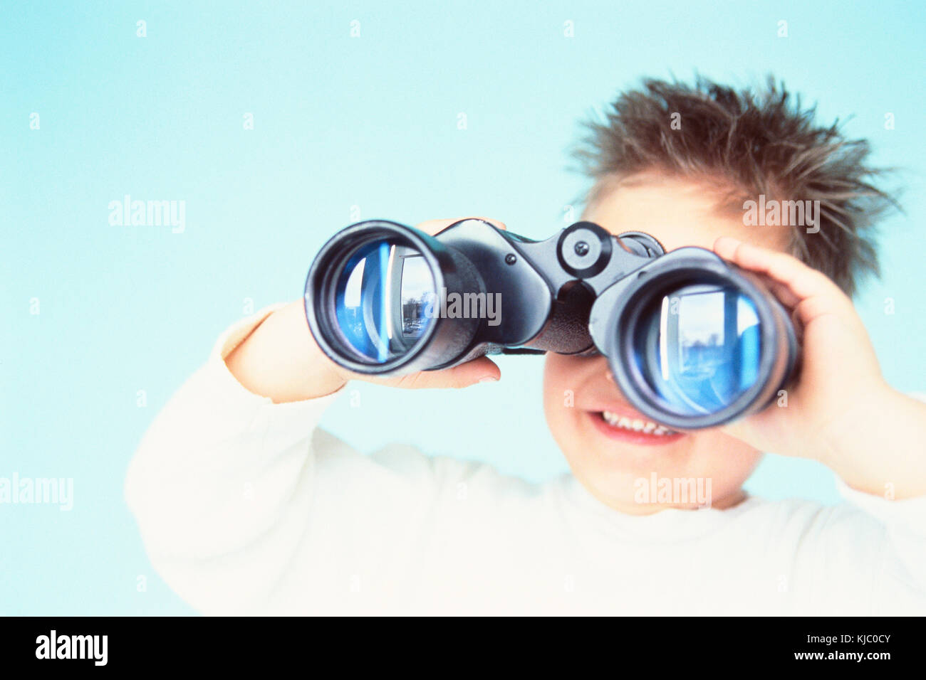 Boy Using Binoculars Stock Photo - Alamy