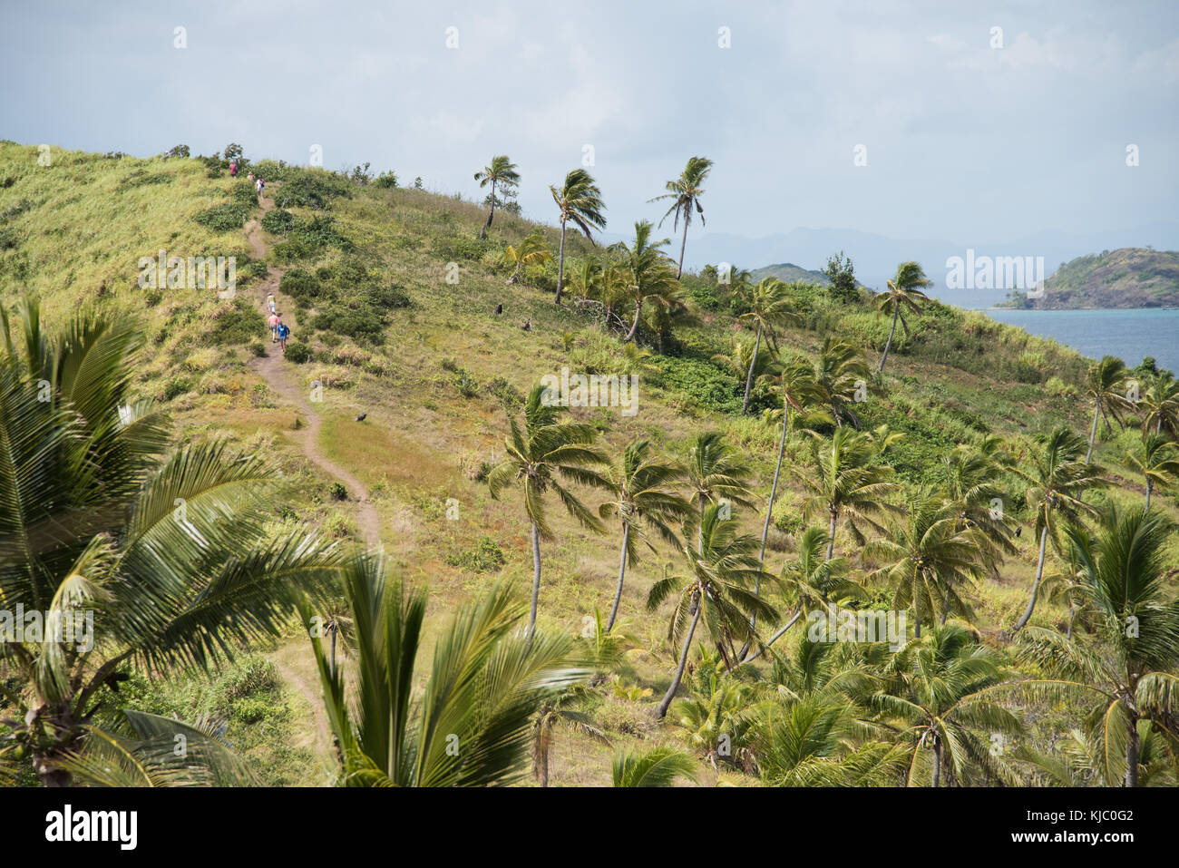 DRAVUNI ISLAND, FIJI, PACIFIC ISLANDS-NOVEMBER 29,2016: People hiking ...