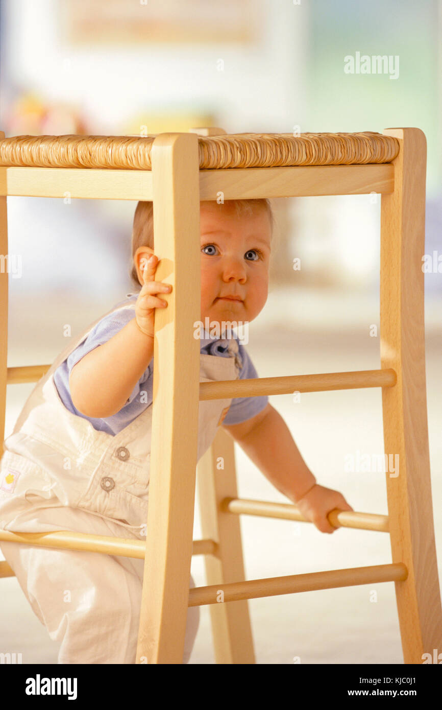 Portrait of Toddler Hiding Stock Photo - Alamy