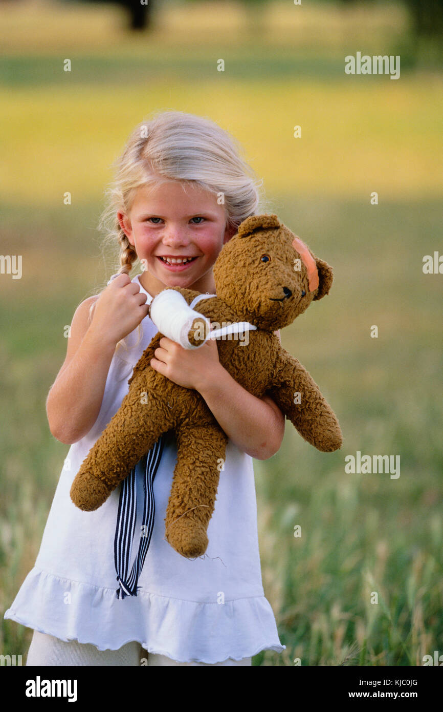 Girl Holding Teddy Bear Stock Photo - Alamy Girl Holding Teddy Bear Stock Photo - Alamy