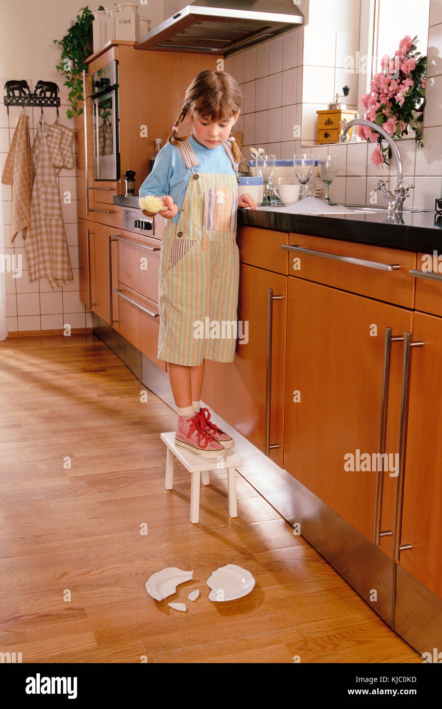 Child Looking at Broken Plate Stock Photo - Alamy