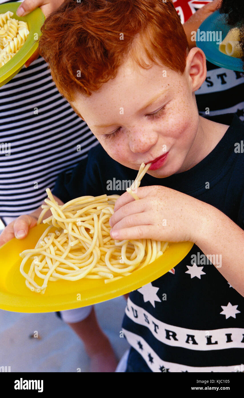 Boy Eating Pasta Stock Photo - Alamy