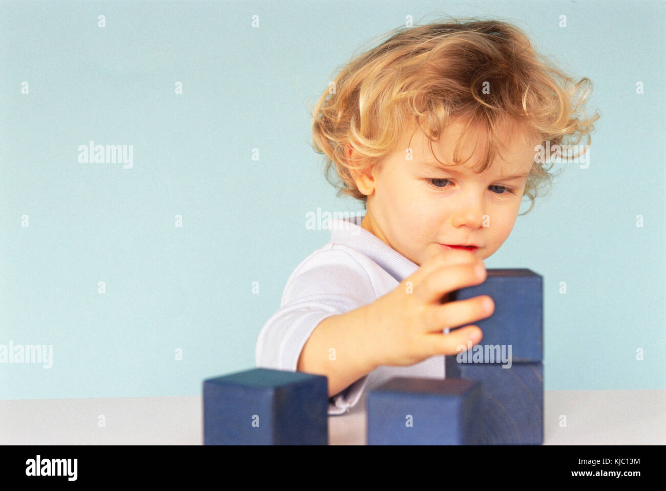 Boy Playing with Building Blocks Stock Photo - Alamy