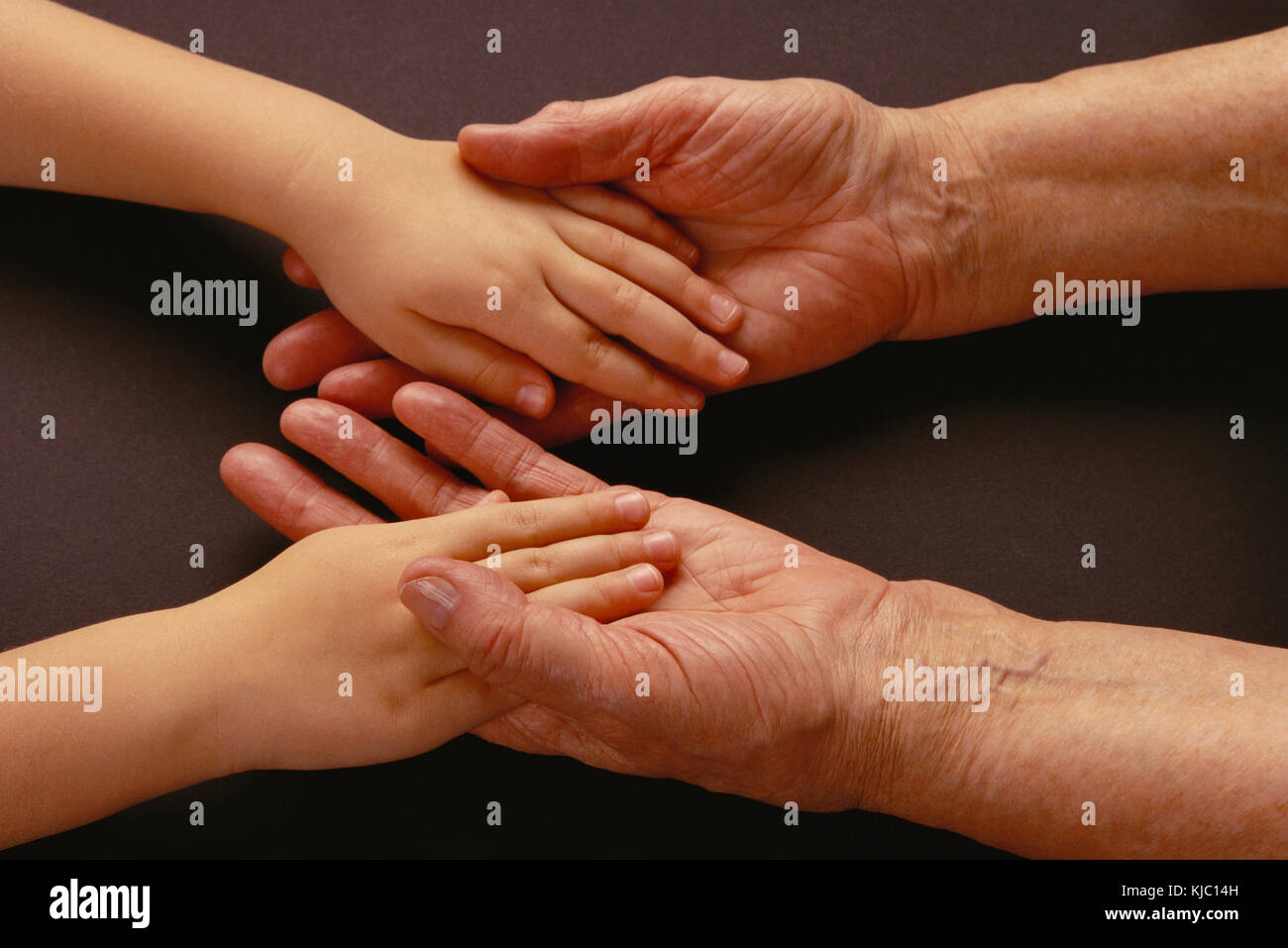 Child's and Adult's Hands Stock Photo - Alamy