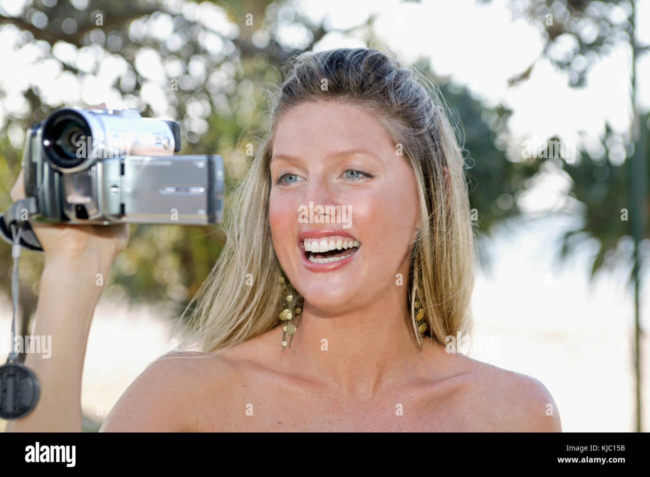 Woman Holding Video Camera Stock Photo - Alamy