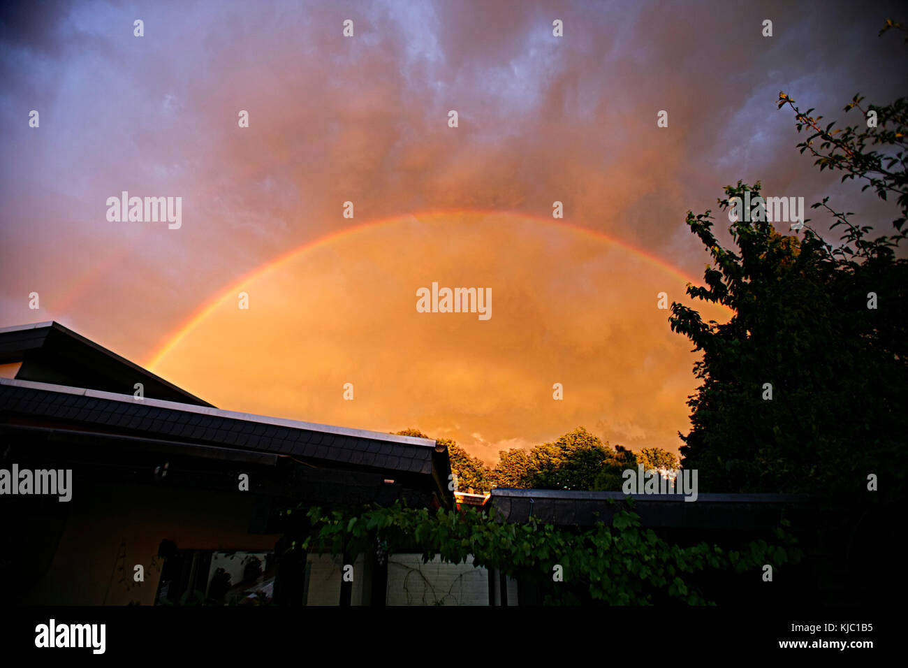 Rainbow Over House Stock Photo - Alamy