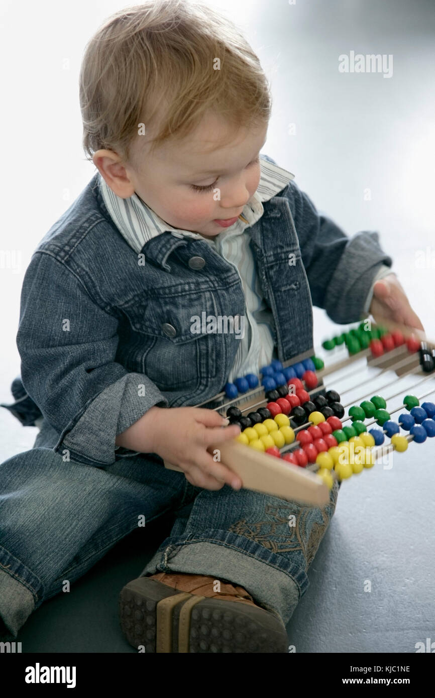 Little Boy Using Abacus Stock Photo - Alamy