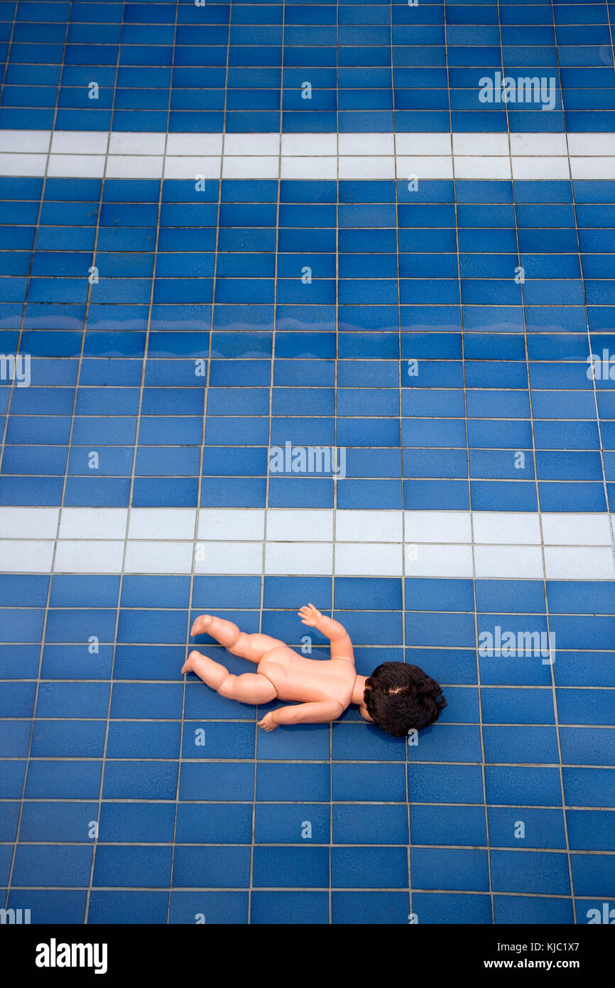 Doll in Empty Pool Stock Photo - Alamy