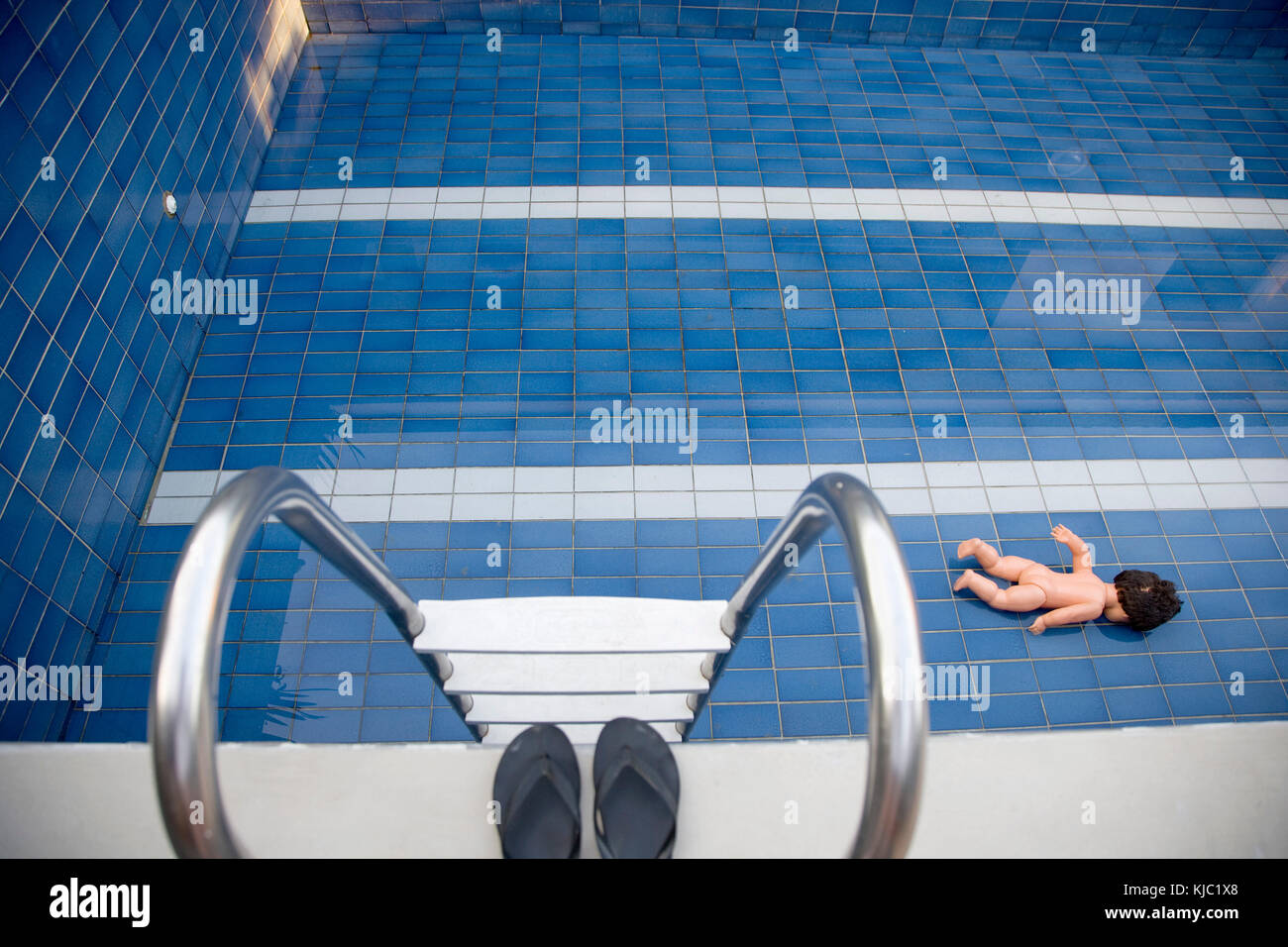 Doll in Empty Pool Stock Photo - Alamy