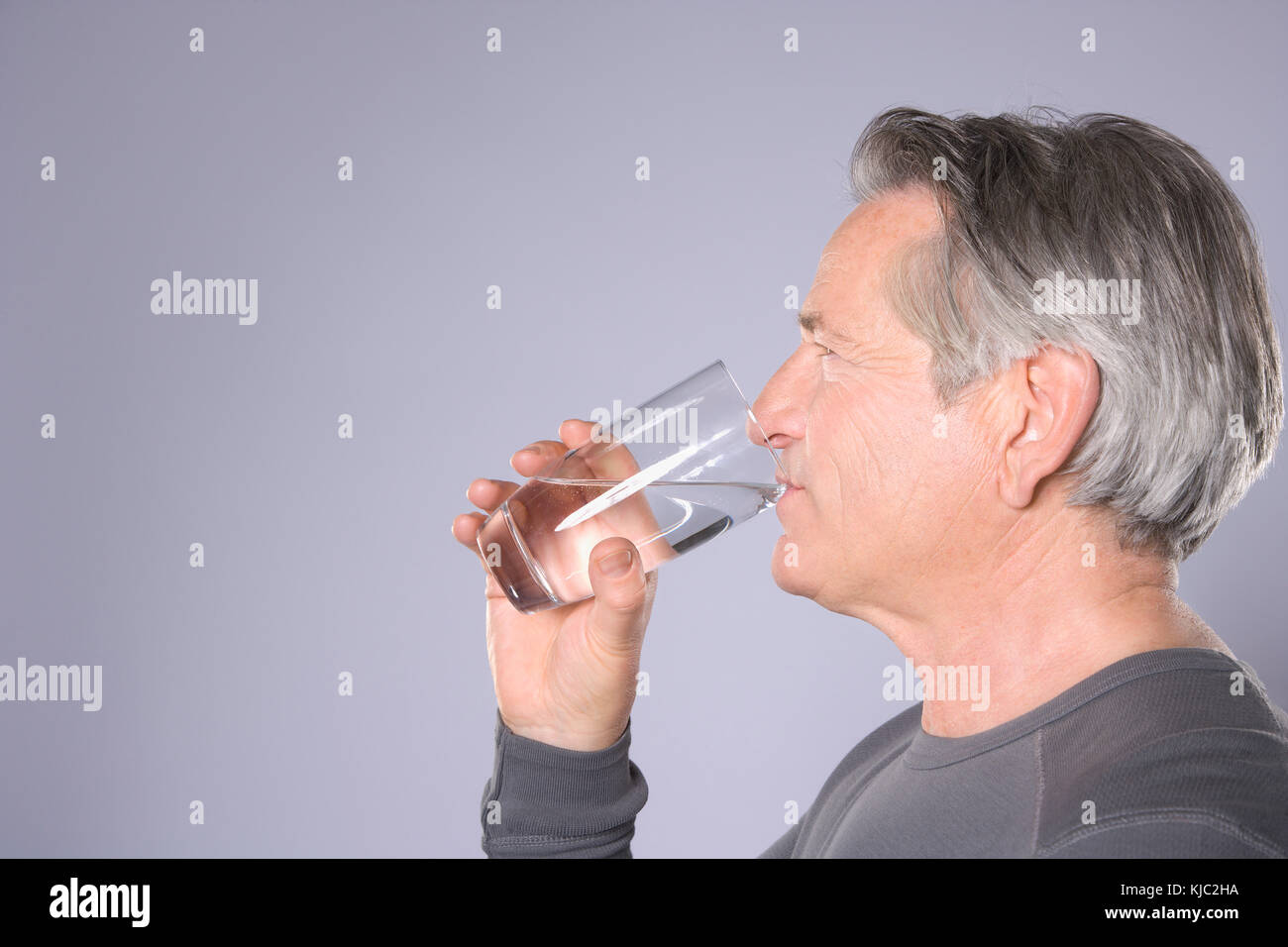 Man Drinking Glass of Water Stock Photo - Alamy