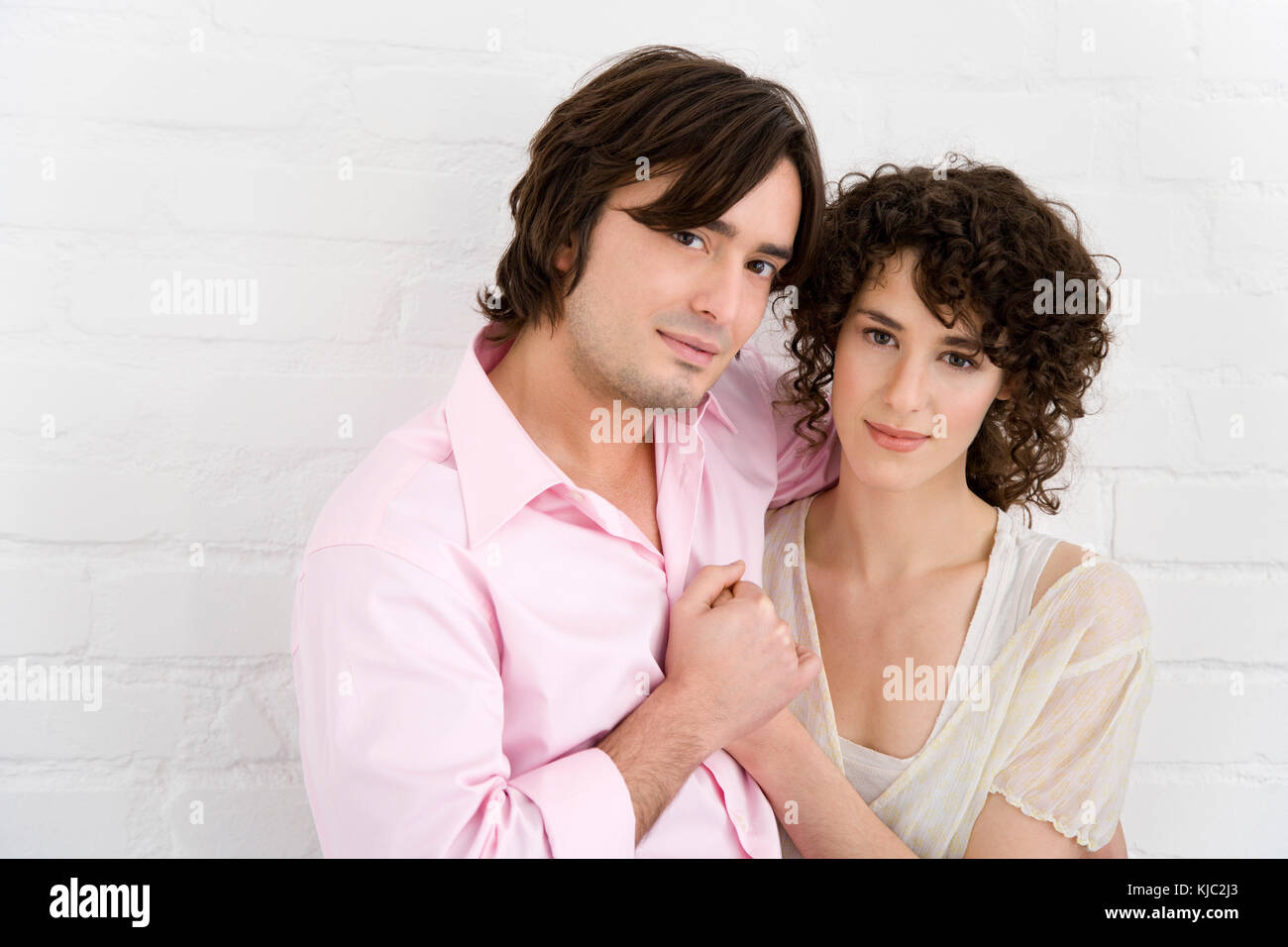 Attractive couple standing arm hi-res stock photography and images - Alamy