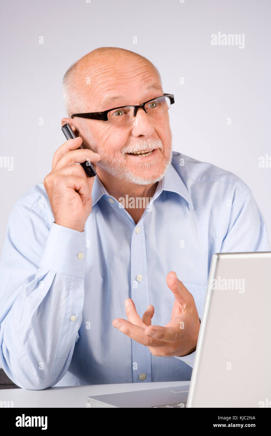 Man with Cellular Phone and Laptop Computer Stock Photo - Alamy