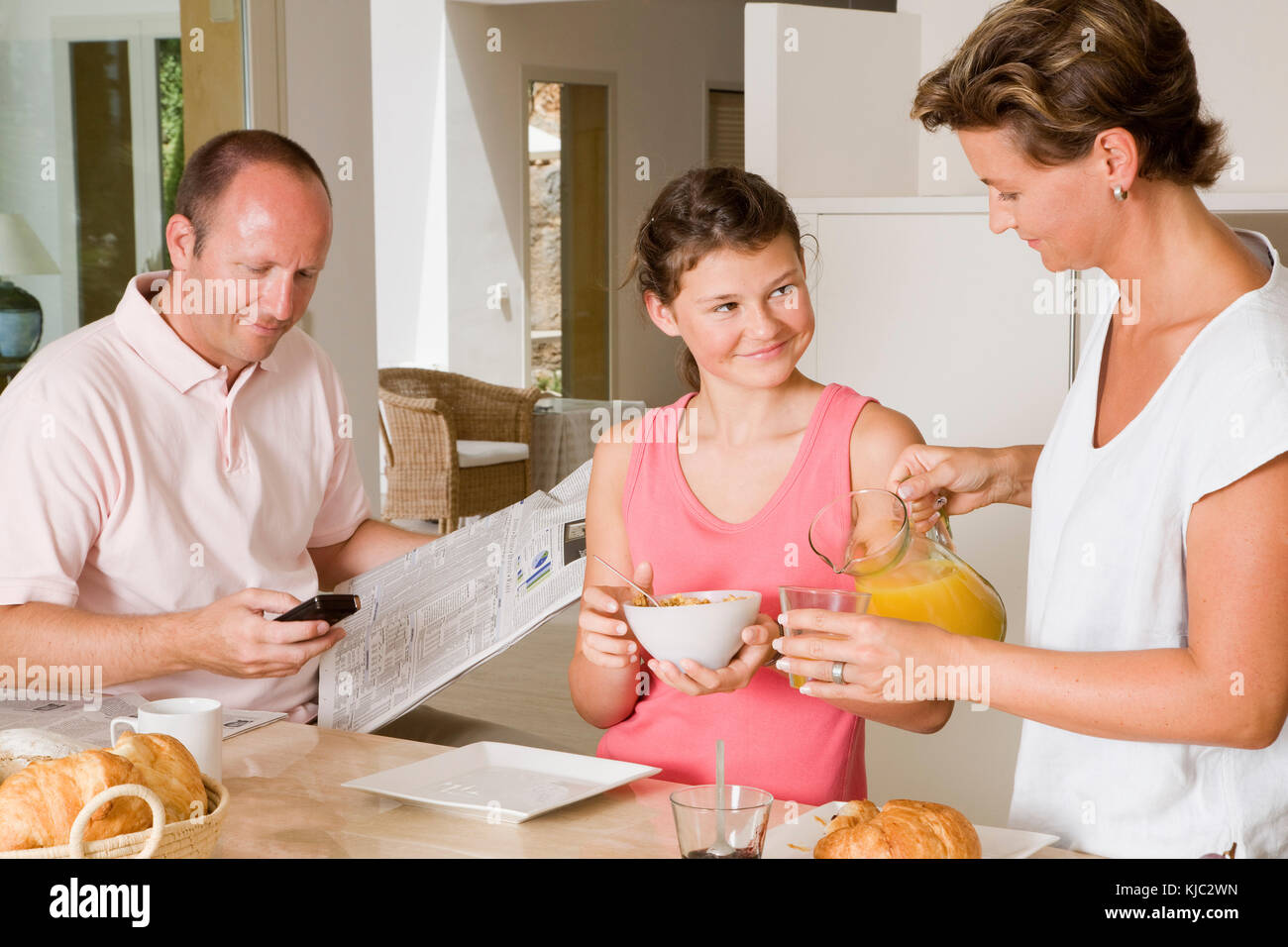 Family in Kitchen Stock Photo - Alamy