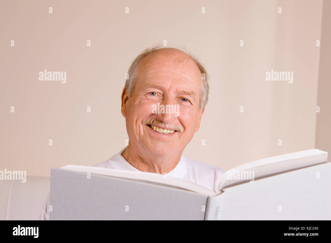 Portrait smiling man reading hi-res stock photography and images - Alamy