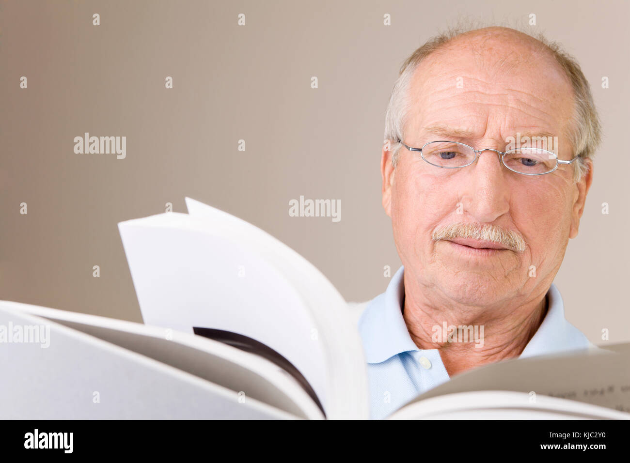 Portrait of Man Reading Book Stock Photo - Alamy