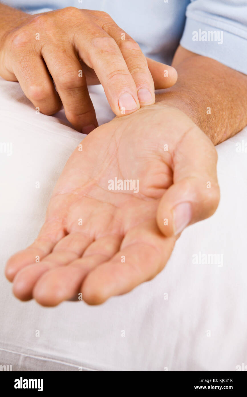 Man's Hand Checking Pulse Stock Photo - Alamy