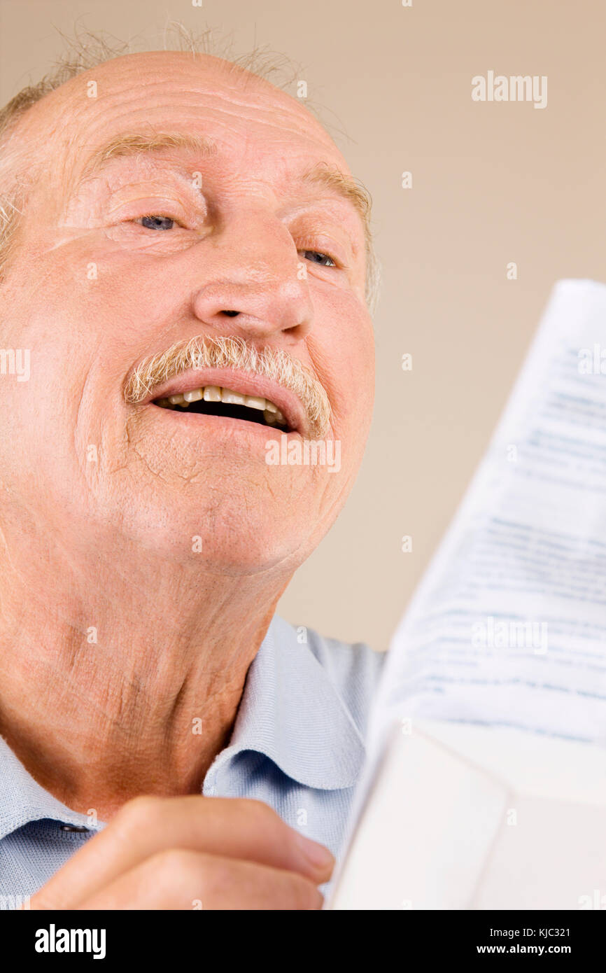 Man Reading Instructions for Medicine Stock Photo - Alamy