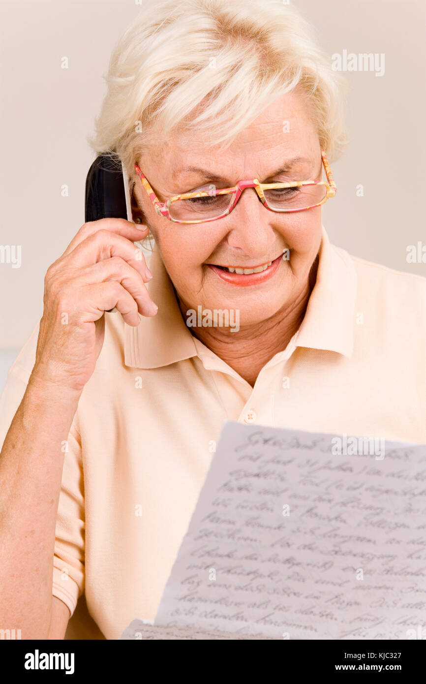 Woman with Letter and Celllular Phone Stock Photo - Alamy