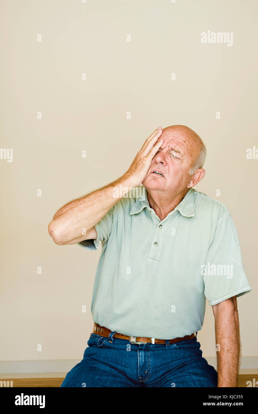 Man with Hand on Face Stock Photo - Alamy