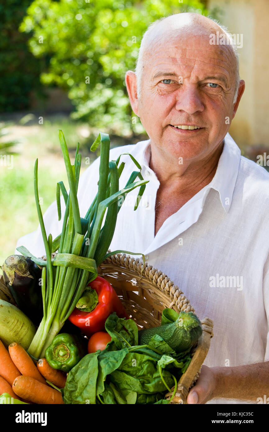 Man Holding Basket of Vegetables Stock Photo - Alamy
