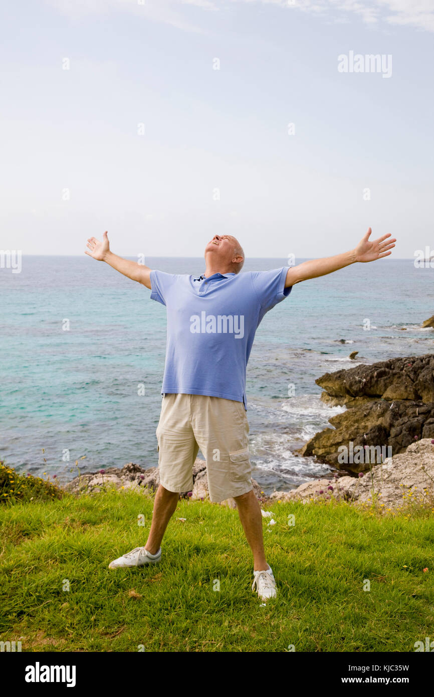 Man Standing Outdoors With Open Arms Stock Photo - Alamy