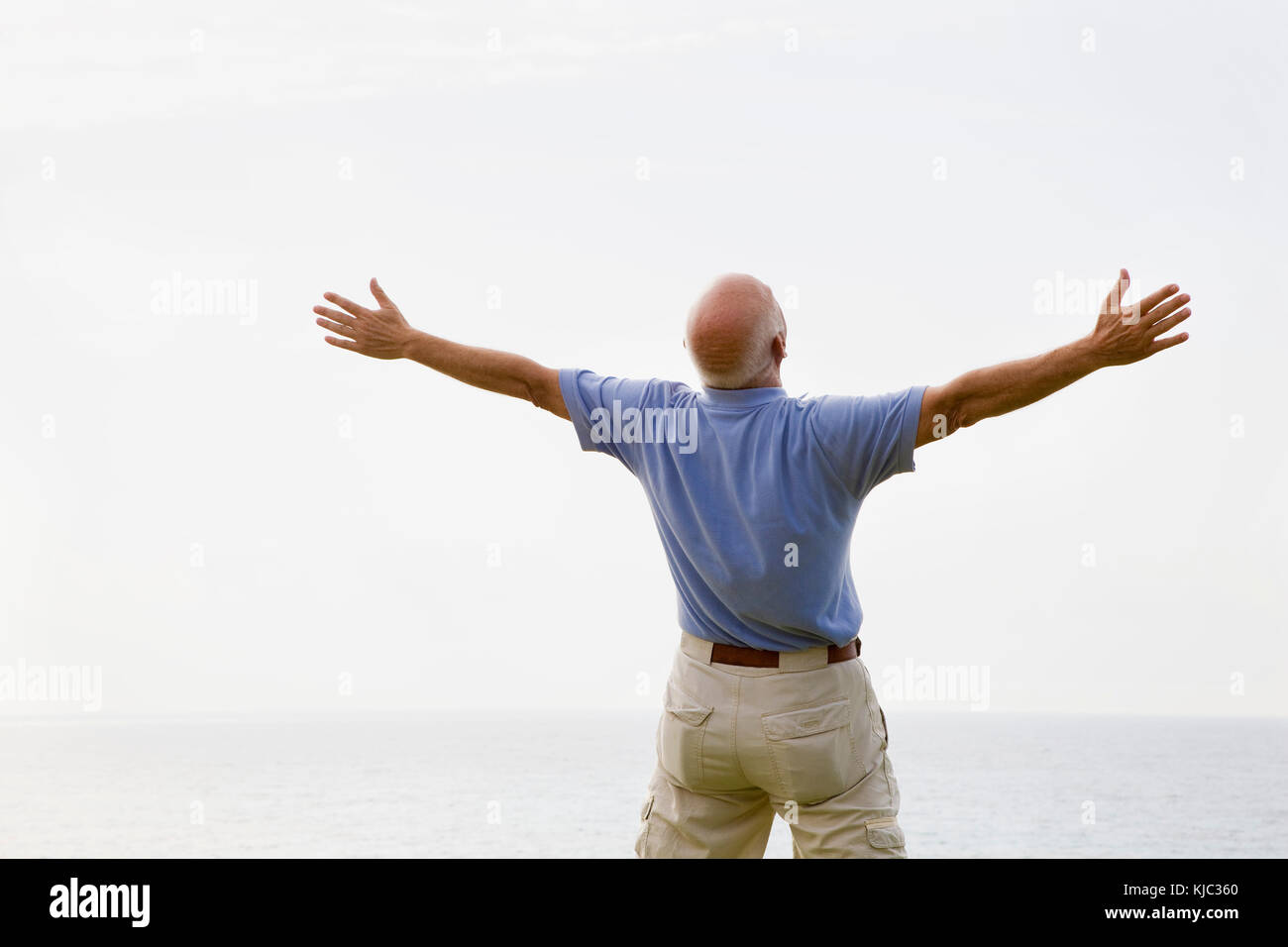 Man Standing Outdoors With Open Arms Stock Photo - Alamy