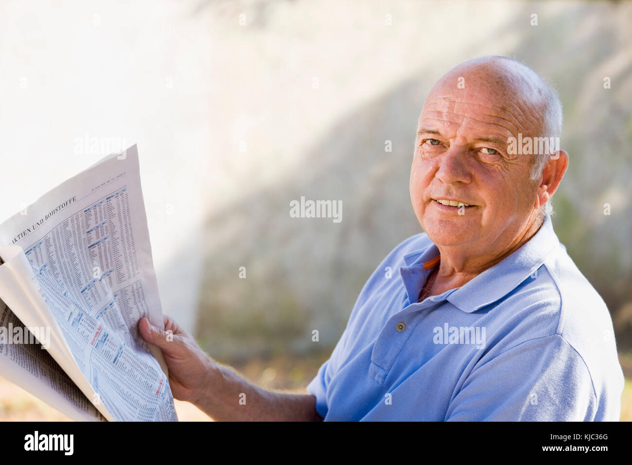 Portrait of Man Reading Newspaper Stock Photo - Alamy