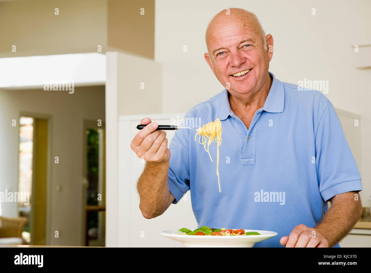 Portrait of Man Eating Spaghetti Stock Photo - Alamy