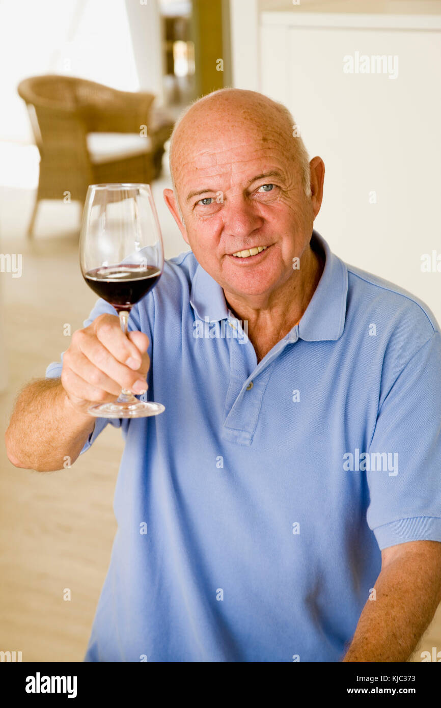 Portrait of Man Raising Glass of Wine Stock Photo - Alamy