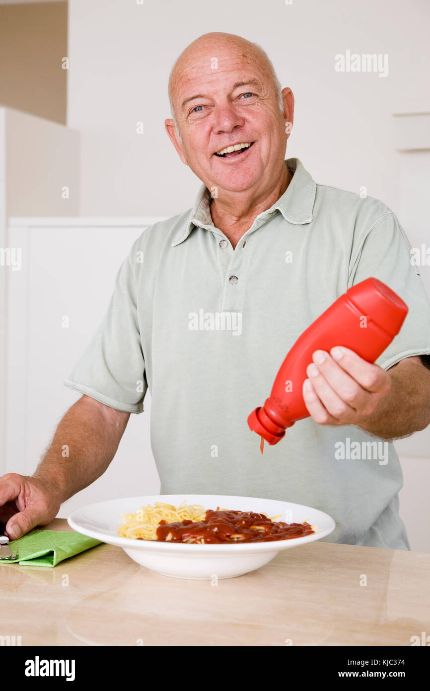 Squeezing ketchup hi-res stock photography and images - Alamy