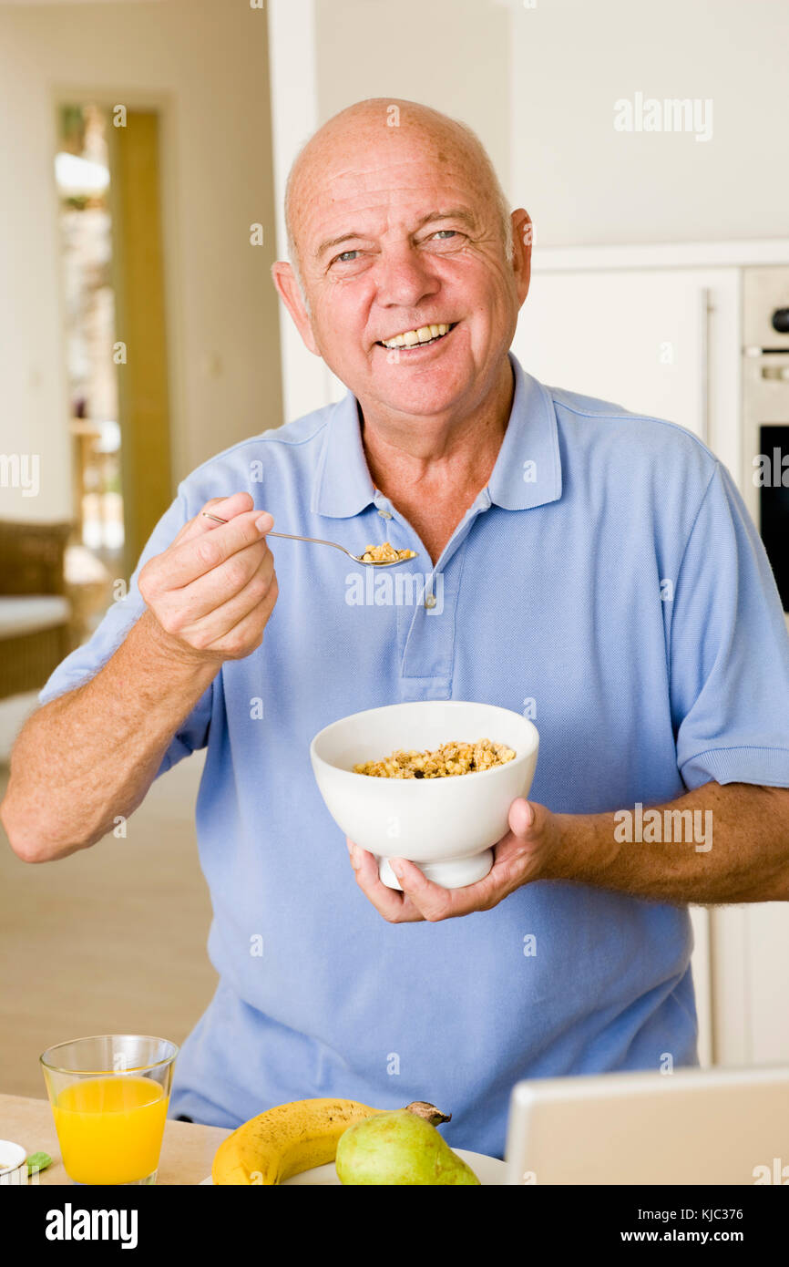 Portrait of Man Eating Cereal Stock Photo - Alamy