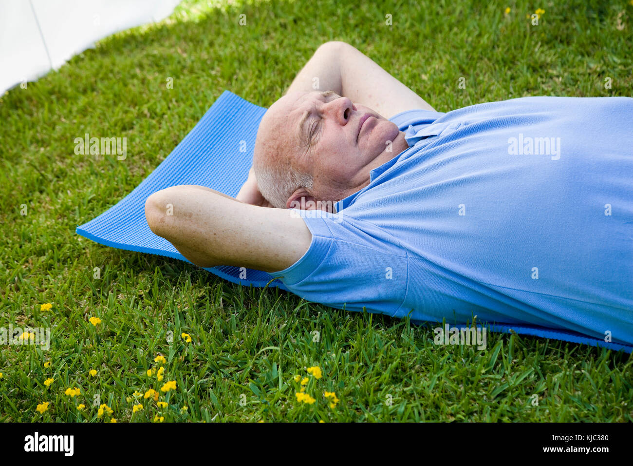 Exercise male mat lying on back hi-res stock photography and images - Alamy