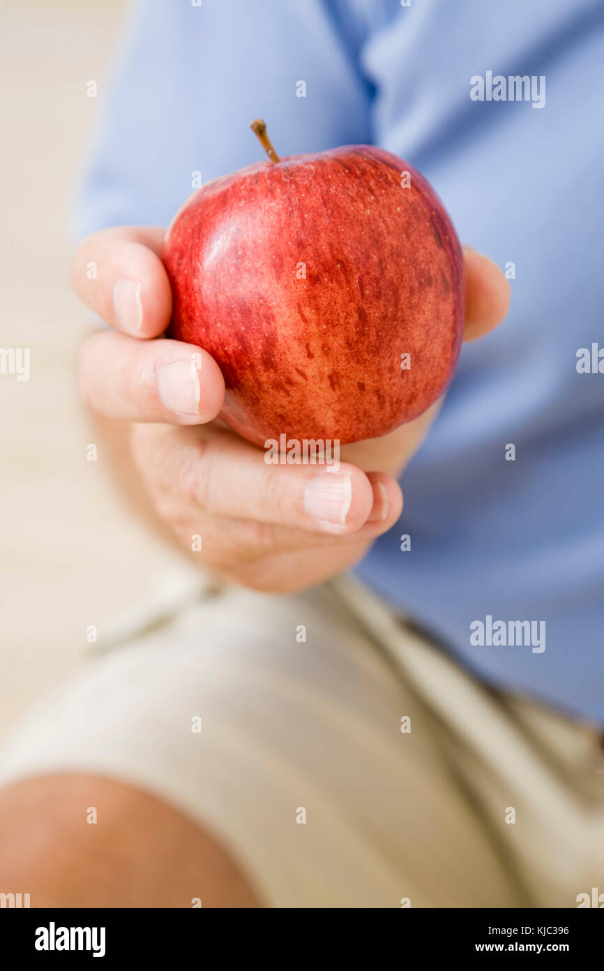 Close-up of Man Holding Apple Stock Photo - Alamy